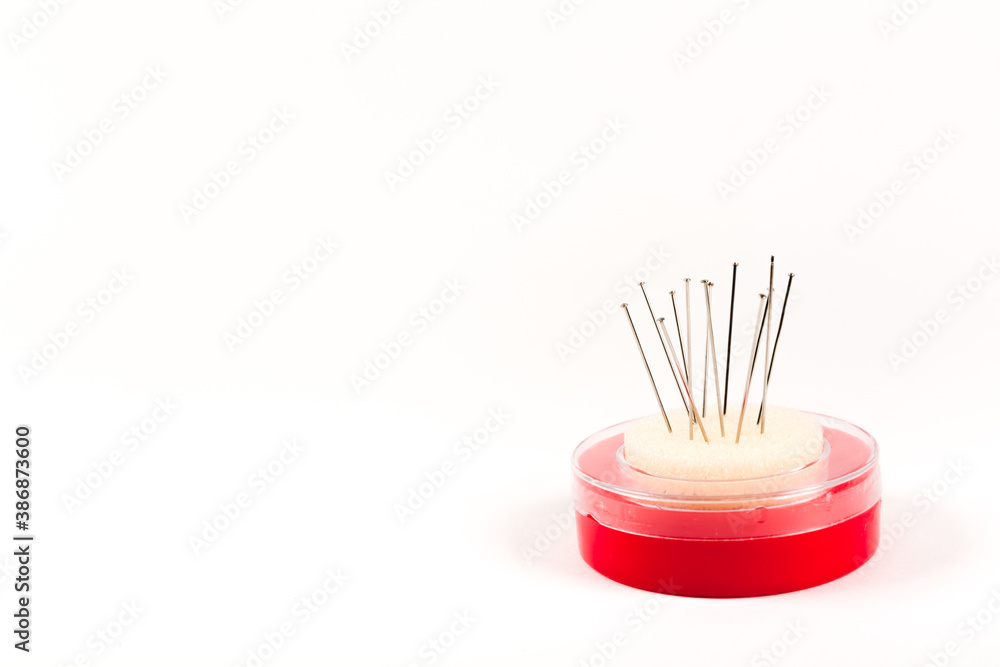 Red pack of tailor pins. Needle storage box with foam rubber pincushion ...