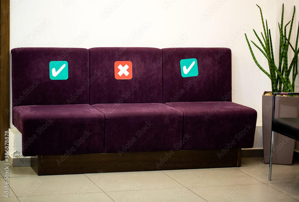Waiting room couch in a hospital with COVID-19 social distance and ...