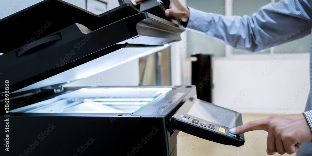 Business man Hand press button on panel of printer, printer scanner ...