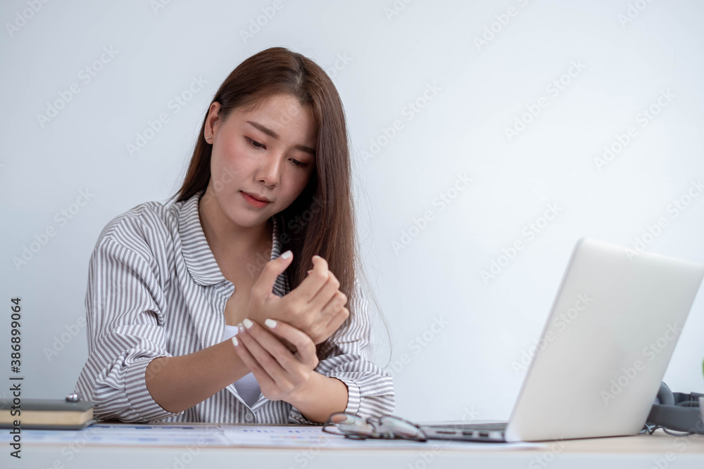 Concept Office Syndrome, young Asian female office worker tired from ...