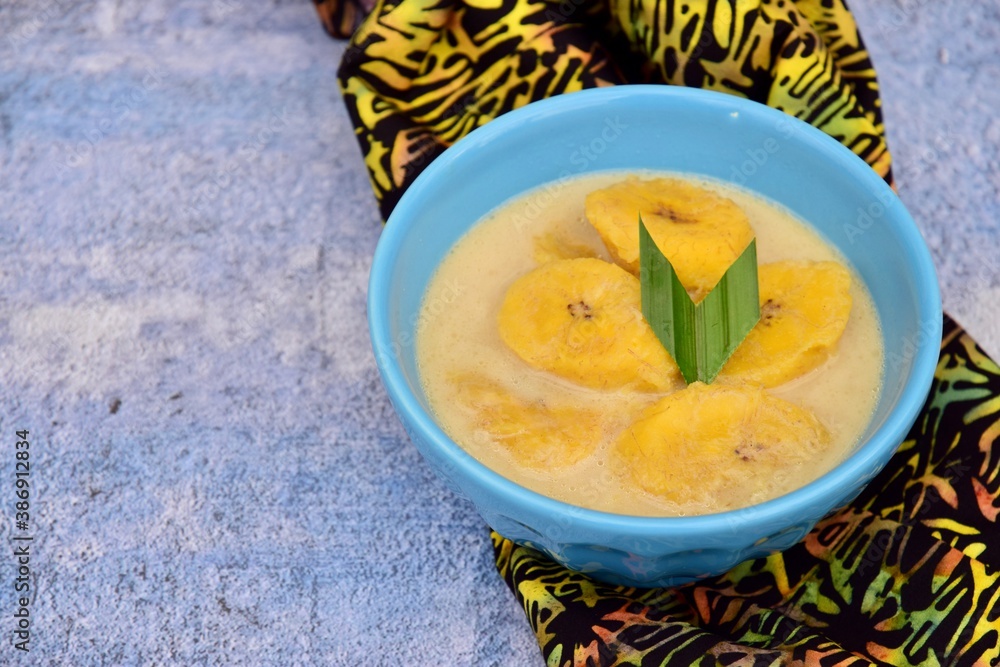 Indonesian traditional food Kolak Pisang. sweet plantain banana with ...