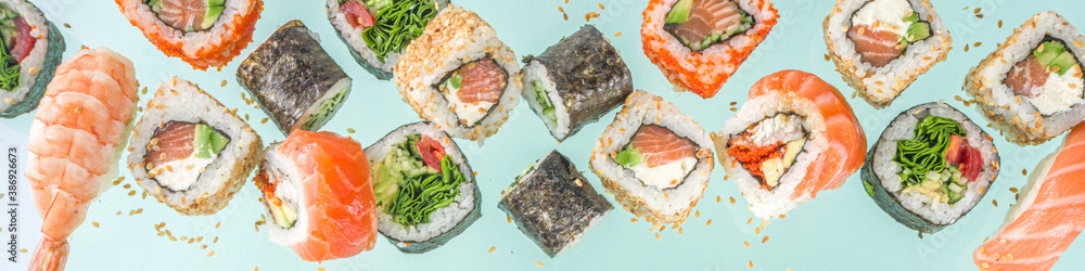 Flying sushi set with chopsticks. Various delicious japanese sushi ...