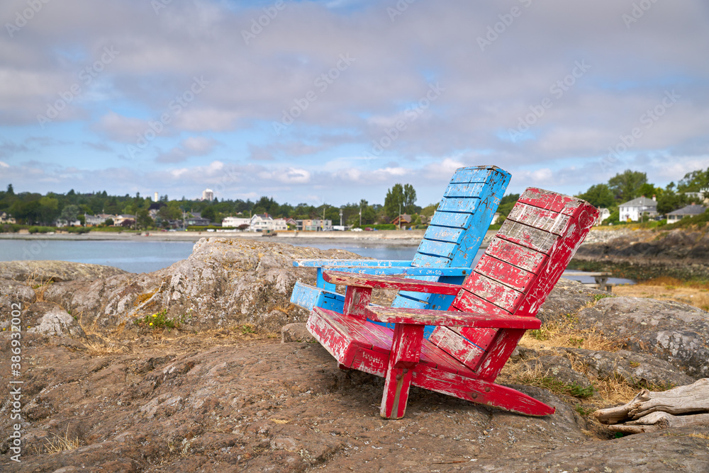 Red and Blue Chairs Victoria. Rustic, weather worn chairs on the rocky ...