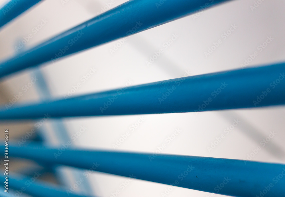 Bright blue color metal stair railings in an abstract form with white ...