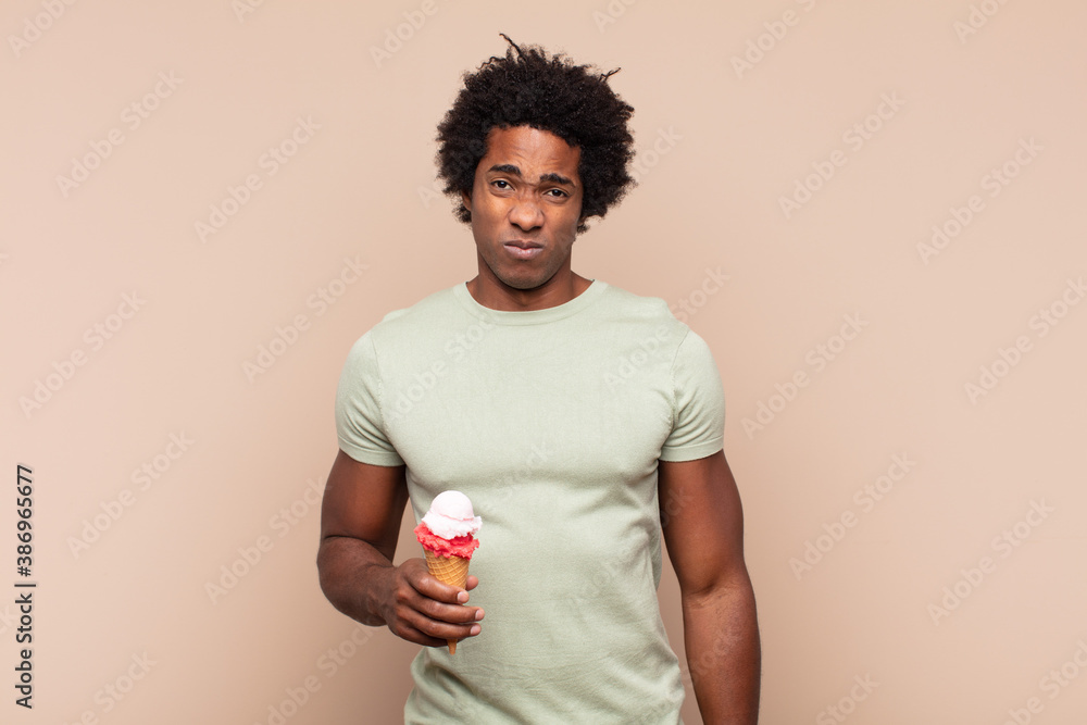young black afro man feeling sad and whiney with an unhappy look ...