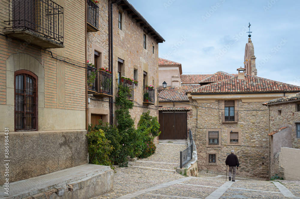 Street of the medieval village of Molina de Aragón with traditional ...