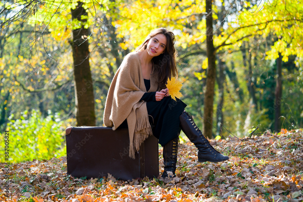 Beautiful woman on a walk in the park. Autumn beautiful woman in forest ...
