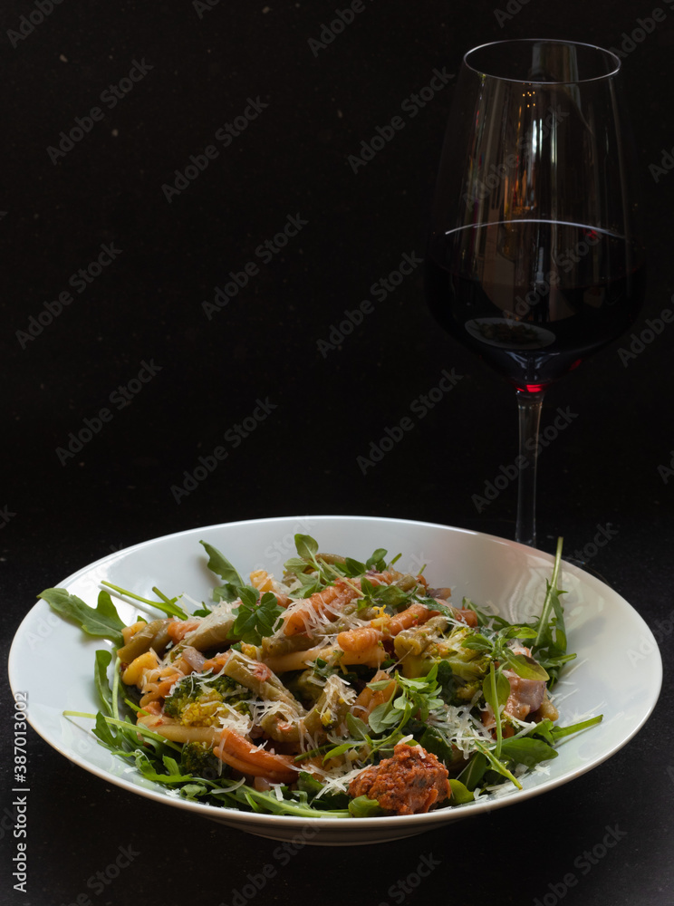 Rucola with caserecce tricolor, pasta with broccoli, red pesto Stock ...