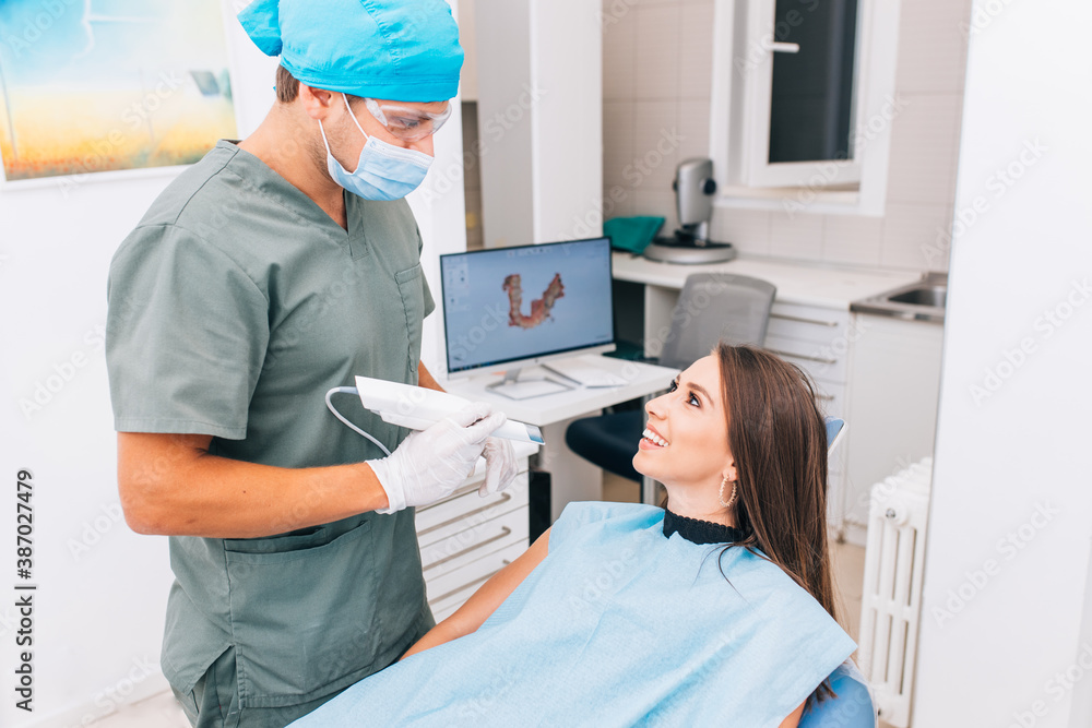 The dentist scans the patient's teeth with a 3d scanner. Stock Photo ...