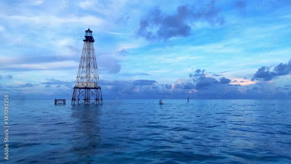 Vidéo Stock Stunning clip of the ocean and a floating lighthouse in the ...