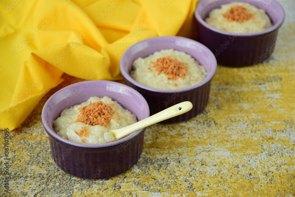 Tapioca pearl pudding dessert with coconut milk garnish with toasted ...