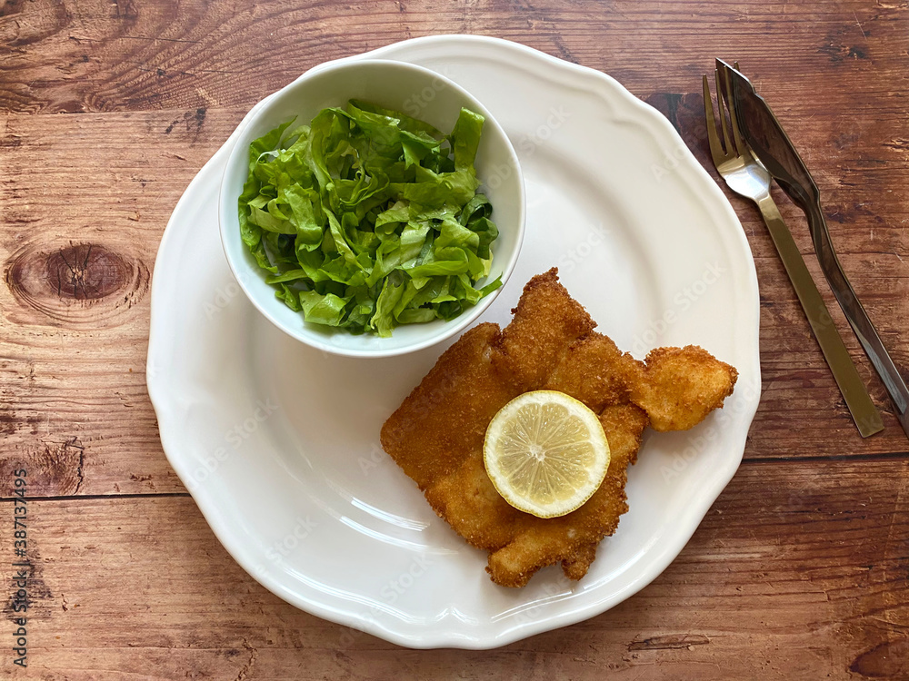 Fotografia do Stock: Breaded cod fish fillet, also known as Kabeljau ...