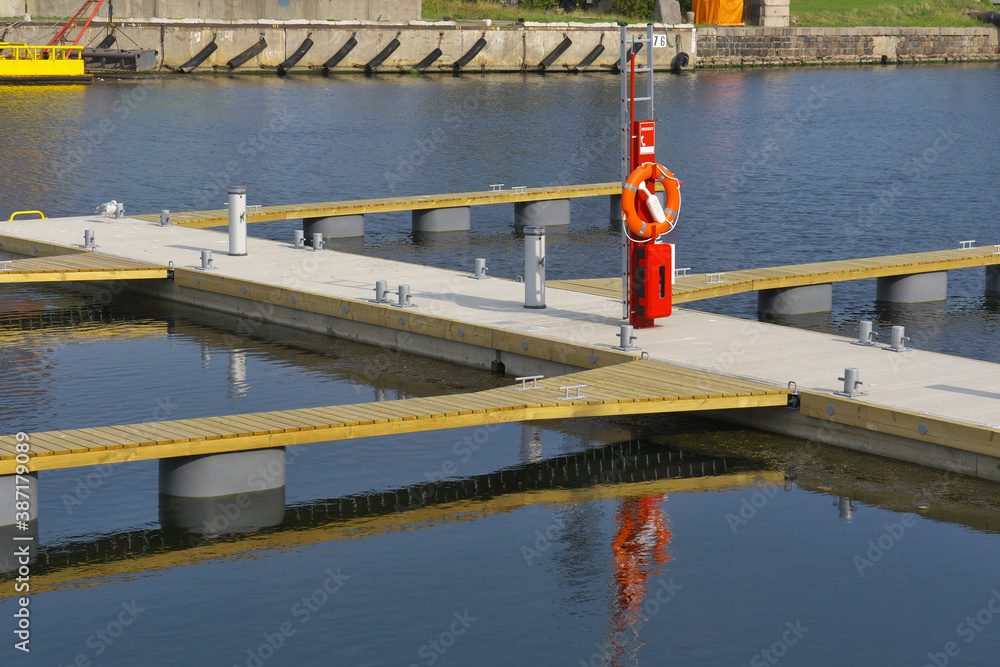 Safety equipment at the yacht berth. Lifebuoy, fire extinguisher ...