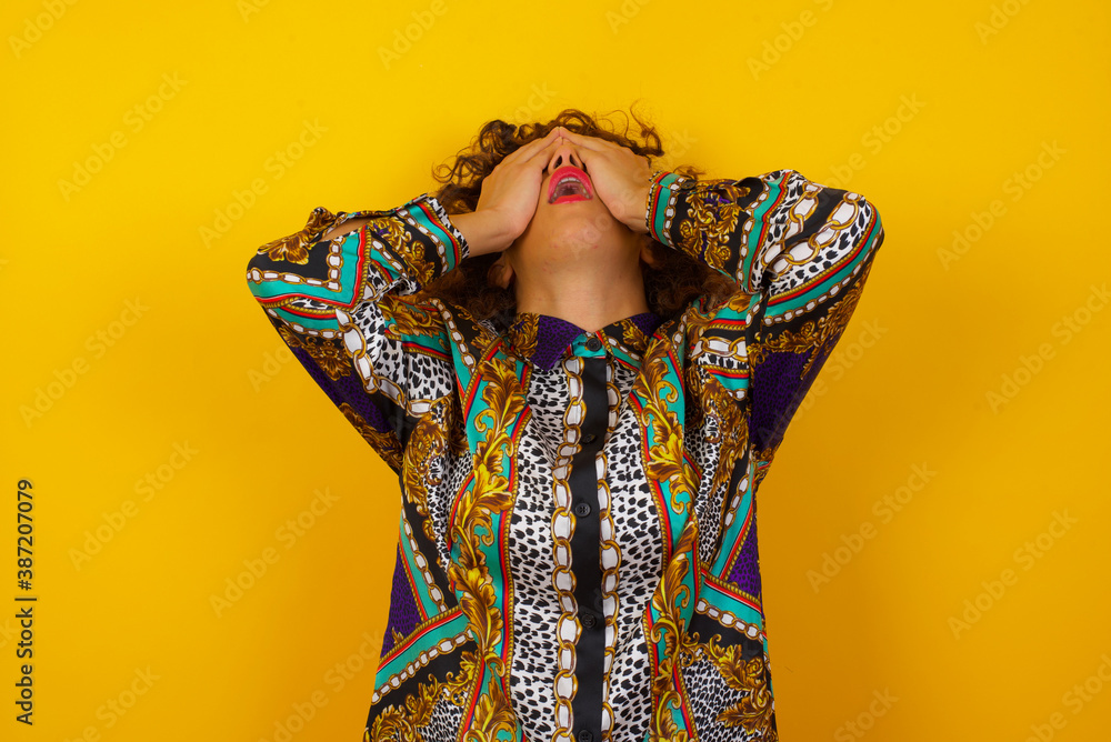Shocked panic Caucasian girl dressed in stylish clothing holding hands ...