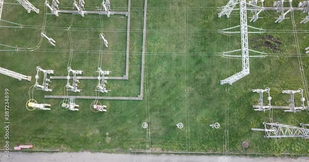 Electrical substation - grid of power lines and wires. Aerial top down ...