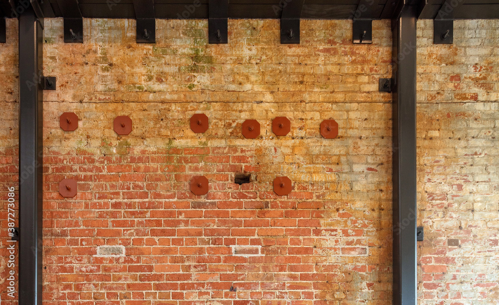 Poster Old red brick wall with new steel reinforcement structure for ...