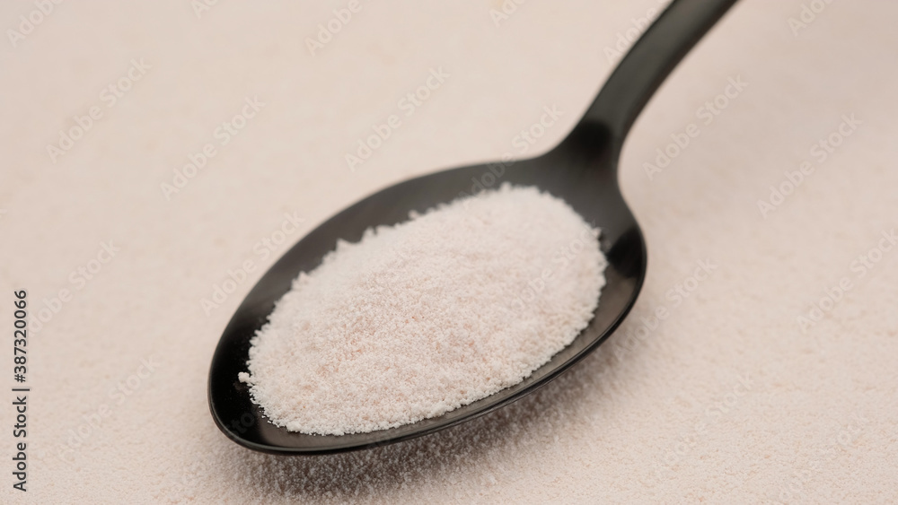 collagen powder in spoon on collagen powder background. Natural beauty ...