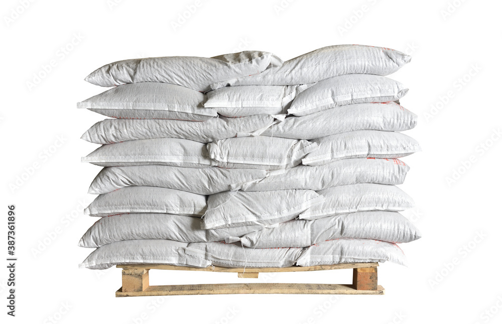 Full white bags stacked on a pallet on isolated white background Stock ...