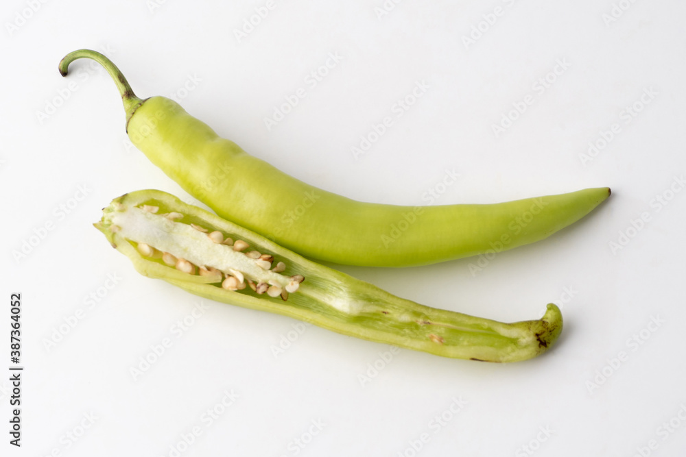 Banana Pepper and half with seeds inside, isolated on a white ...