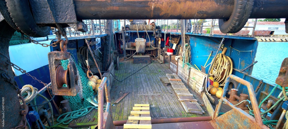 Deck of a sea trawler. Nets, winches and other equipment on view. Stock ...