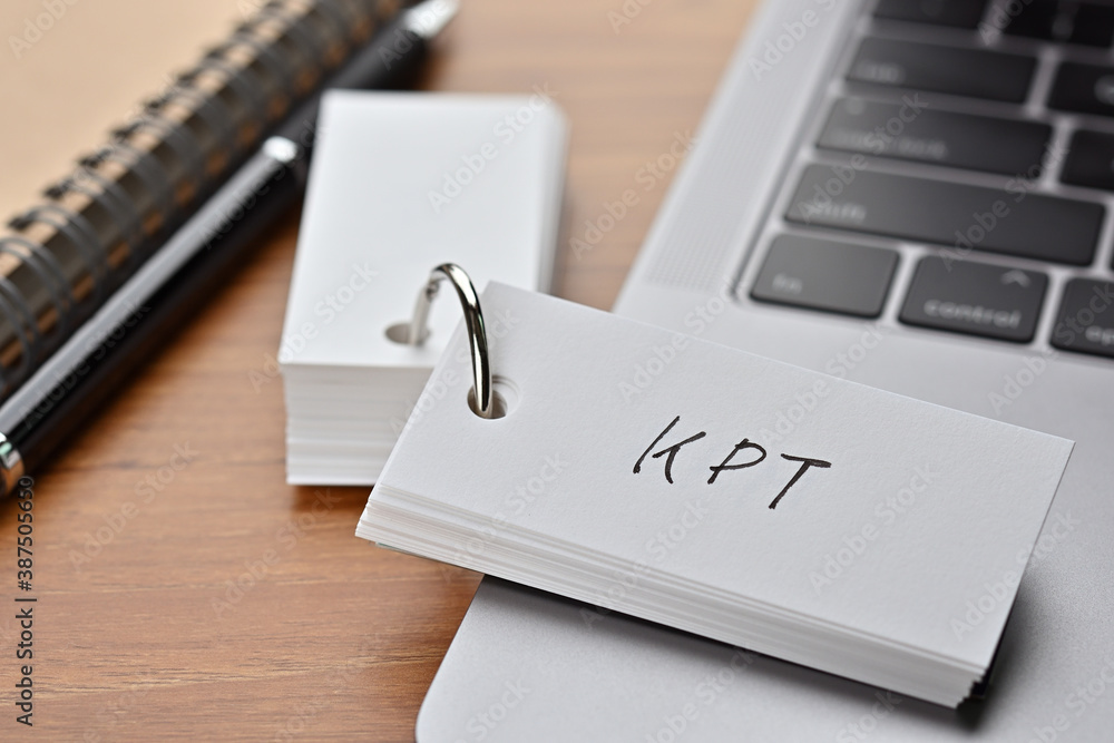 Fotka „The words "KPT" written in a word book with laptop PC and a pen ...