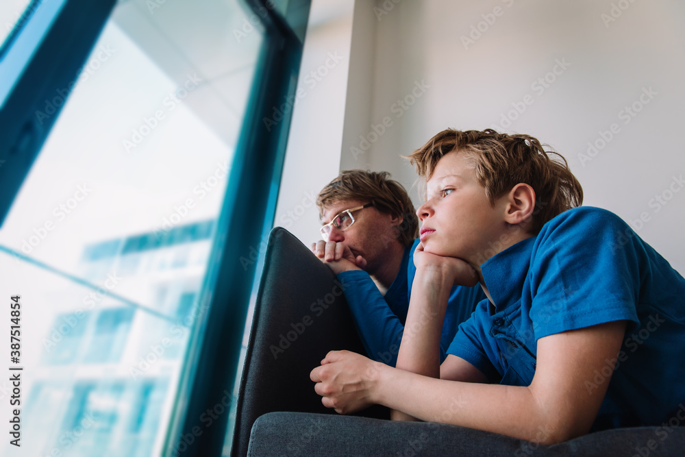 sad child with stressed father staying home, family on lockdown Stock ...