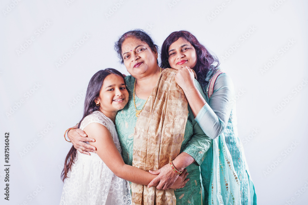 Female generations: Indian grandmother, mother and daughter posing ...