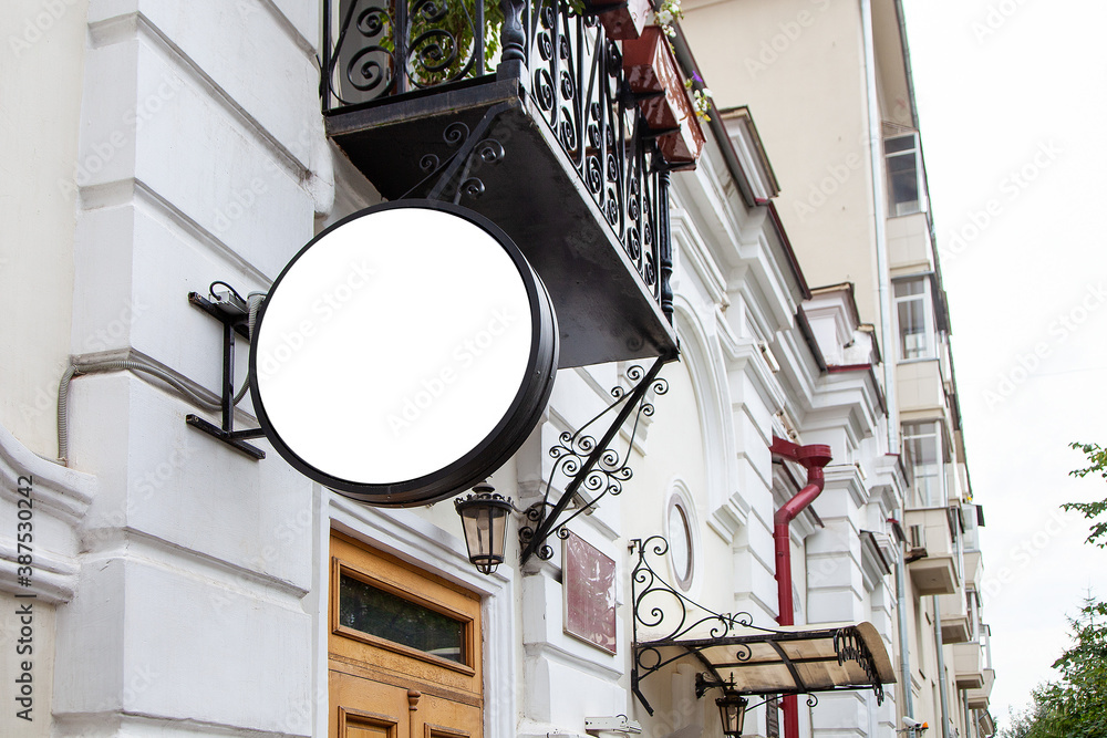 round sign on the building, copy space Stock Photo | Adobe Stock