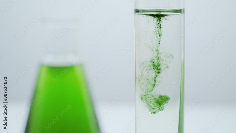 Chemical experiment. Close-up test tube, with colorless liquid and ...