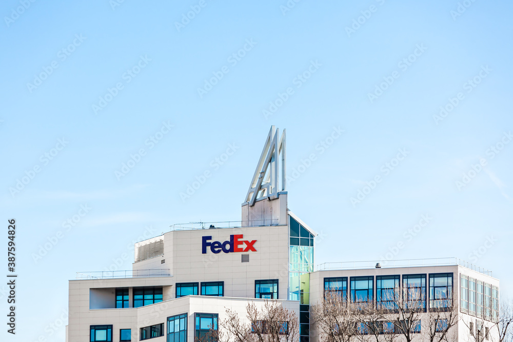 FedEx Corporation brand logo on office building Stock Photo | Adobe Stock