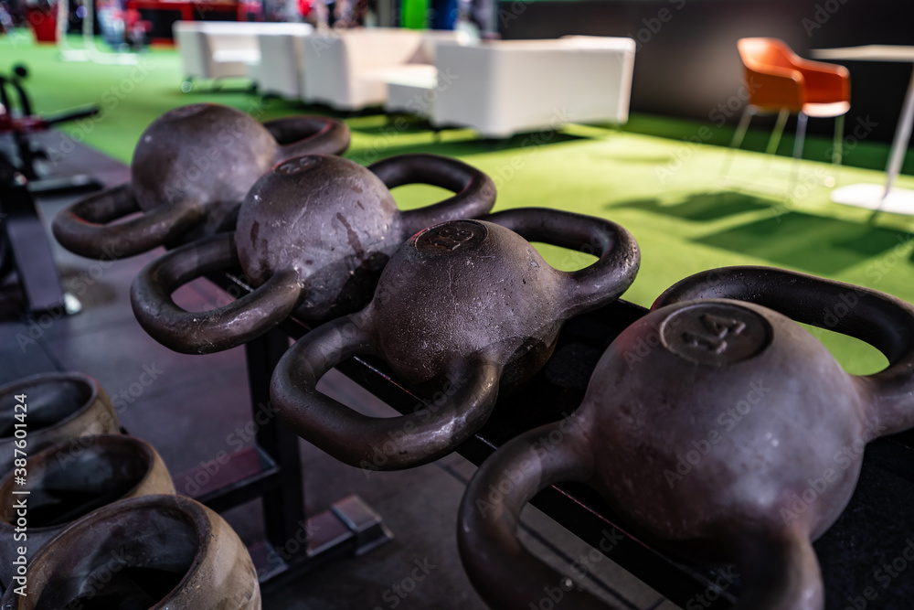 Dumbbell rack in the fitness room. Large dumbbell rack near the mirror ...
