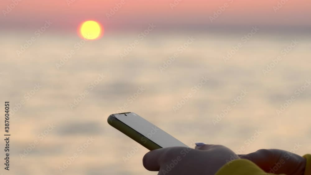 Close-up of a woman hand texting in a messenger or texting on a ...