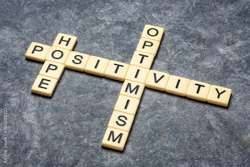 hope, positivity and optimism crossword in ivory letter tiles against ...
