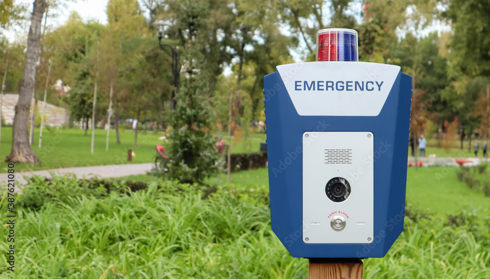 Emergency button in a public city park with an English word emergency ...