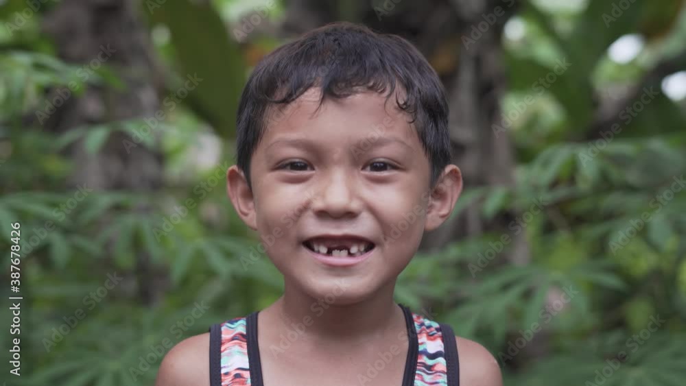 Close Up Video Portrait of a Handsome Cute Toothless Asian Filipino Kid ...