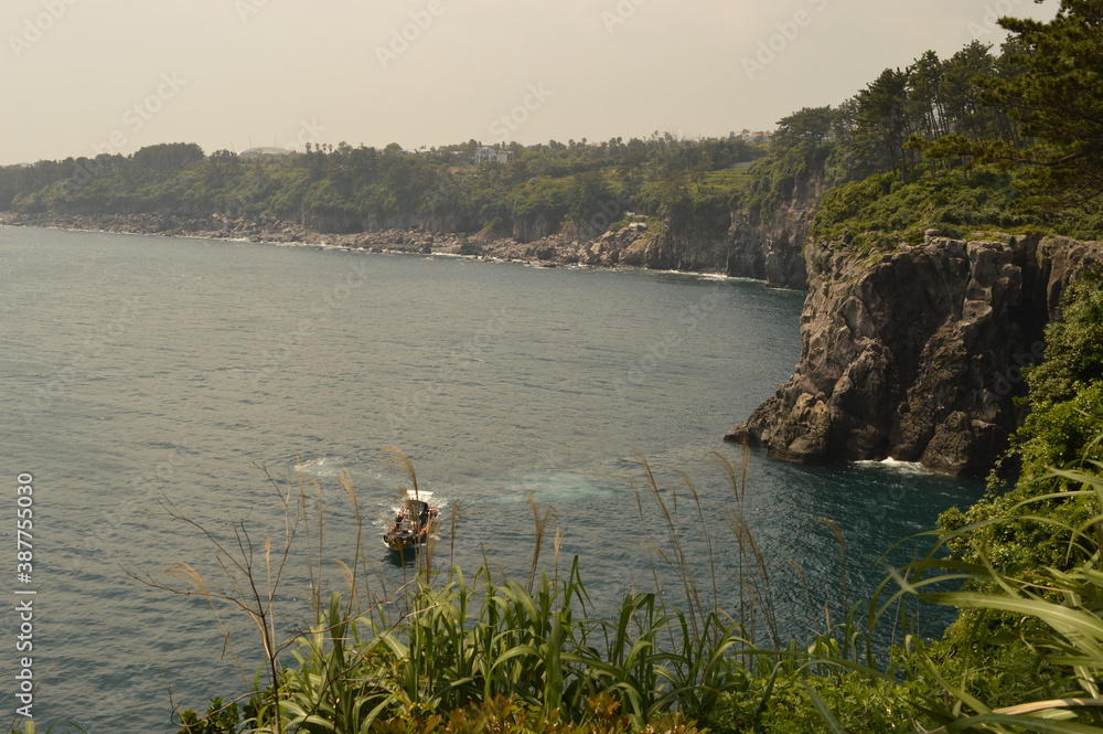 Exploring the waterfalls and coastal landscapes of the Jeju Island in ...