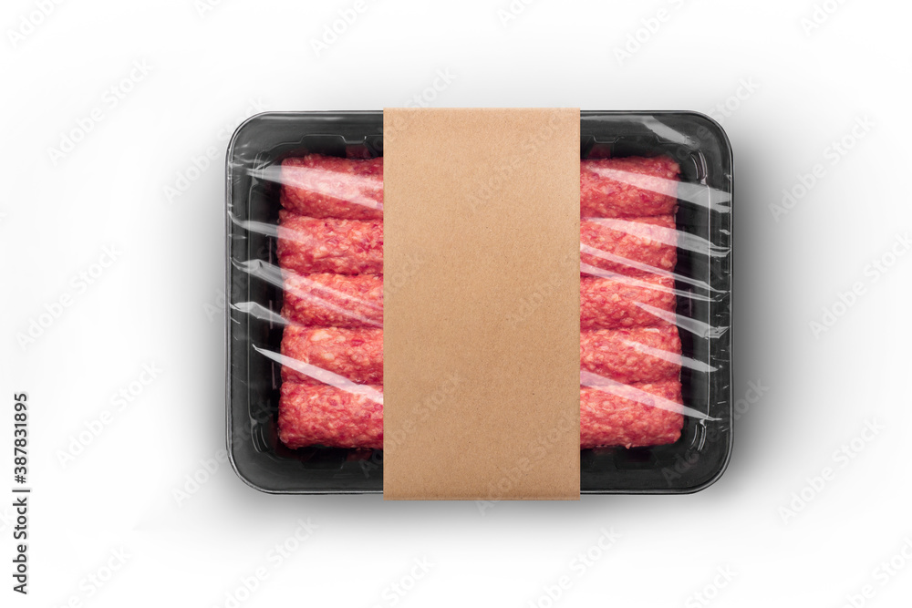 Sealable black plastic tray with craft paper label filled with fresh ...