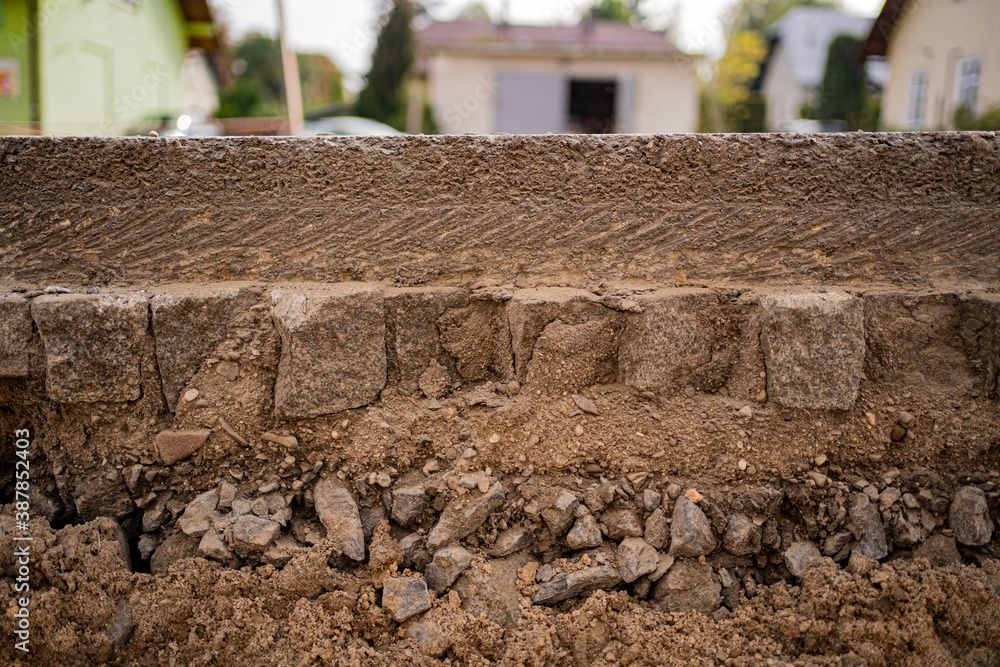 Structure of highway road with visible layers of asphalt, stone and ...