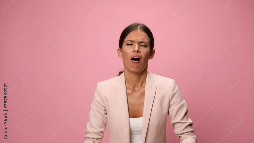 Vidéo Stock disappointed young businesswoman in pink suit making a sad ...
