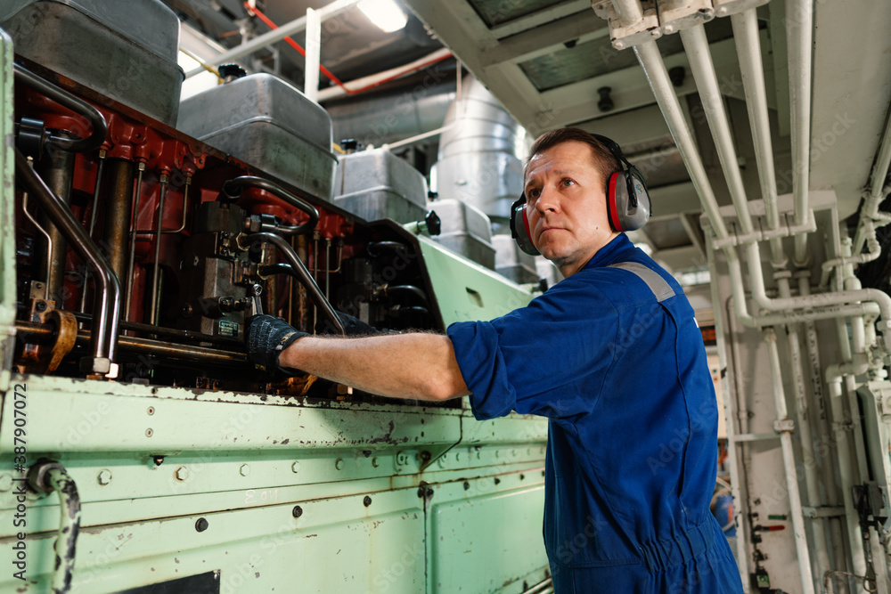 Marine engineer officer controlling vessel enginesand propulsion in ...