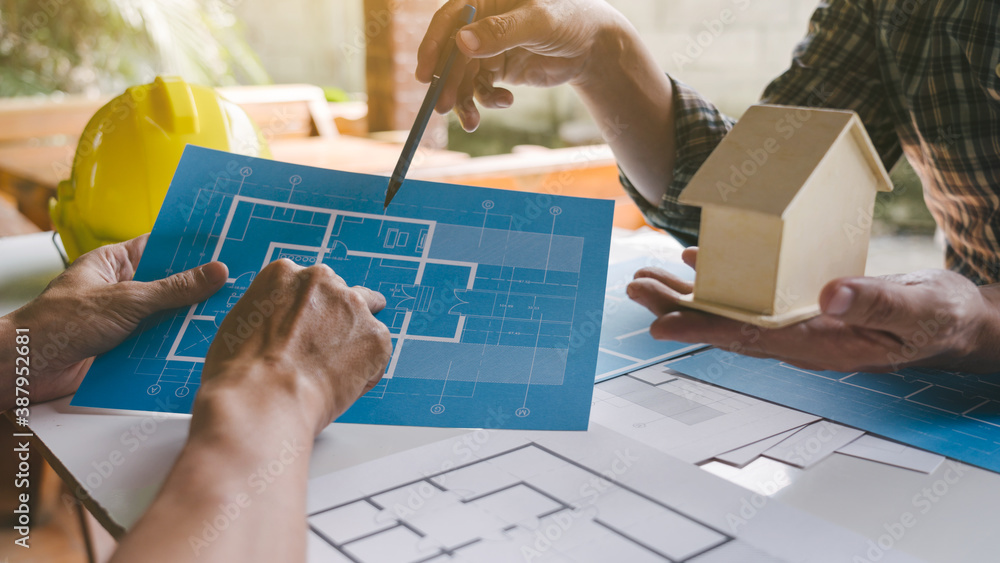 Friends of architect engineer helping to creating and design building ...