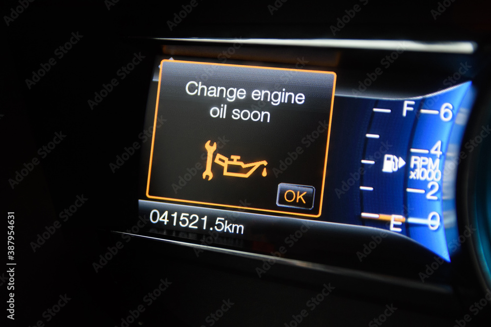 The on-board computer of a modern car with color infographics warns the ...