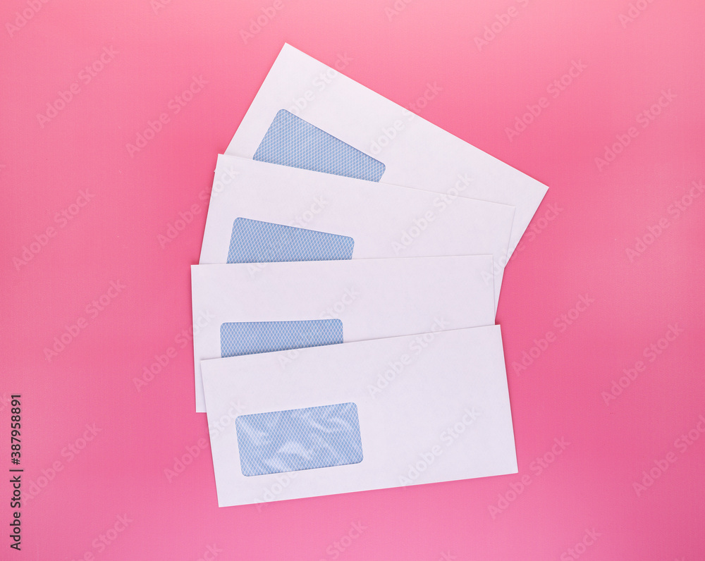 Blank envelopes with address window isolated on pink background. White paper envelopes mockup ...