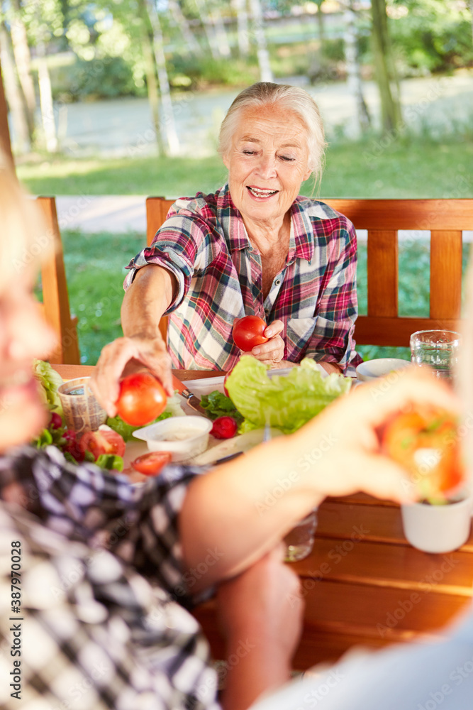 Seniors eat healthy organic tomatoes for brunch Stock Photo | Adobe Stock