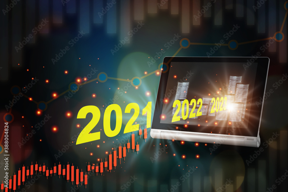 New year 2021, 2022 and 2023 out of computer tablet with stack of coins ...