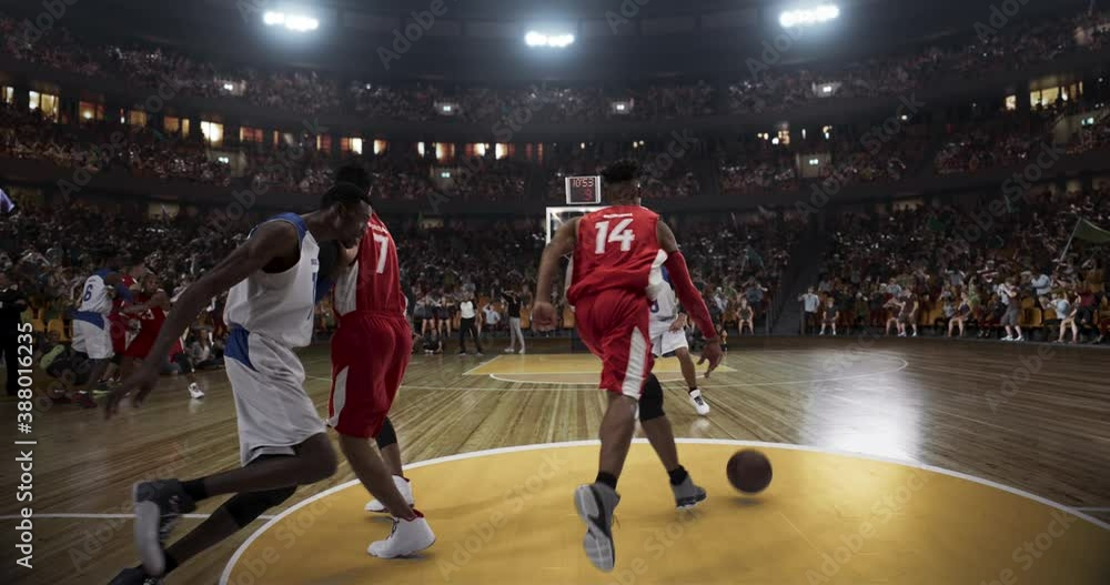 Basketball player scores a goal on a professional basketball stadium ...