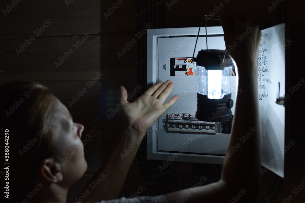 electrical panel with power buttons in house. In evening lights were ...