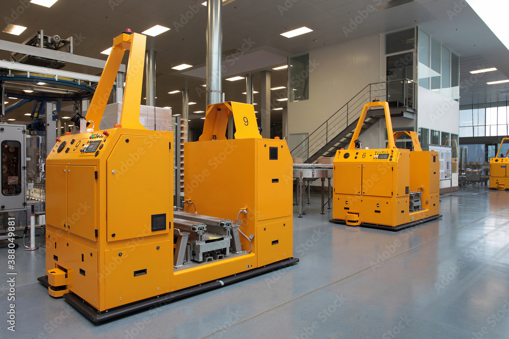 Self-propelled transport robots in a factory Stock Photo | Adobe Stock