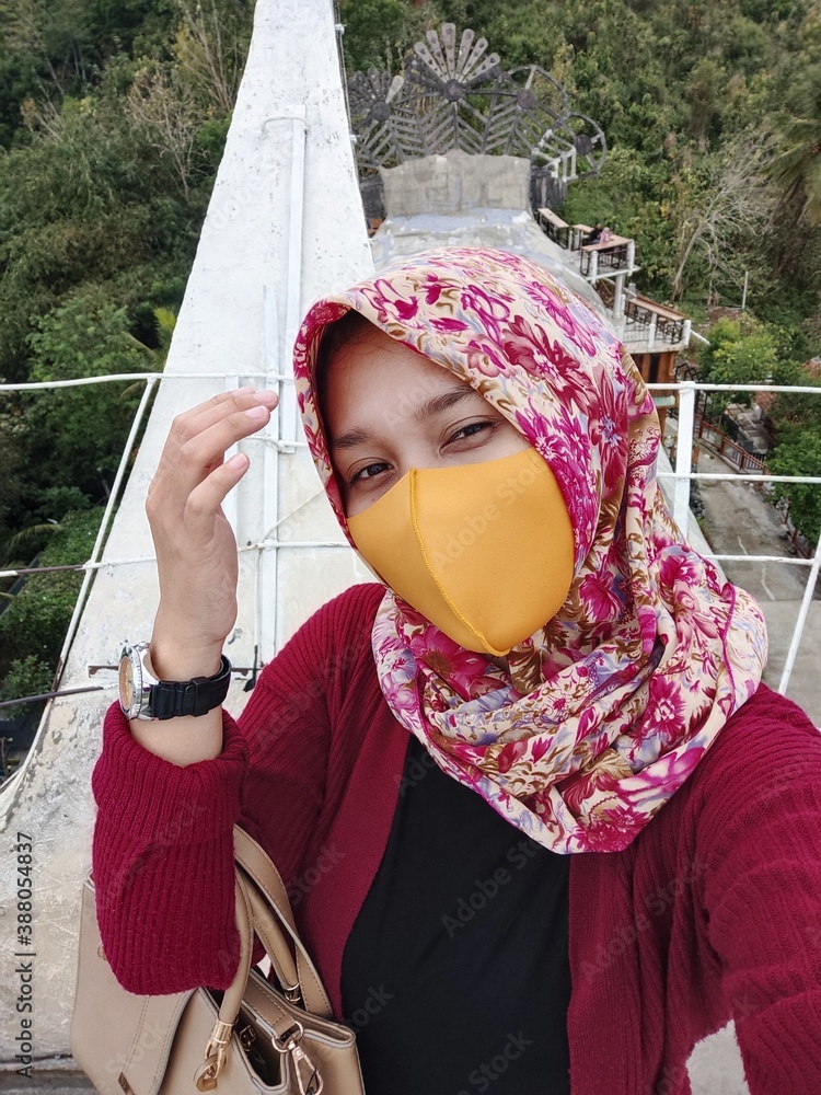 women wearing hijab wearing masks stand on high buildings " Bukit Rhema ...