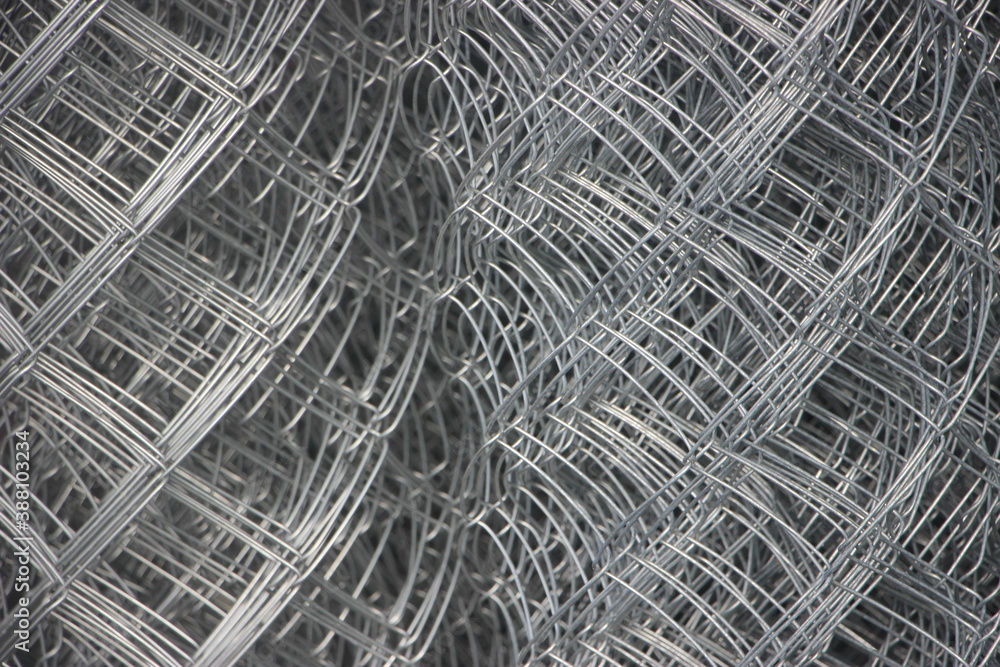 Metal mesh rabitz netting rolled into rolls and coils of steel wire ...